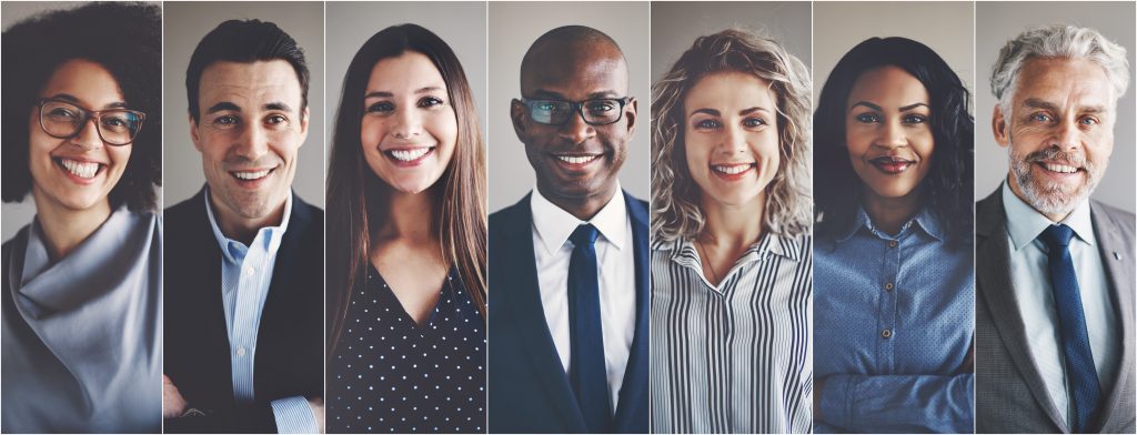 Smiling group of ethnically diverse businessmen and businesswome ...